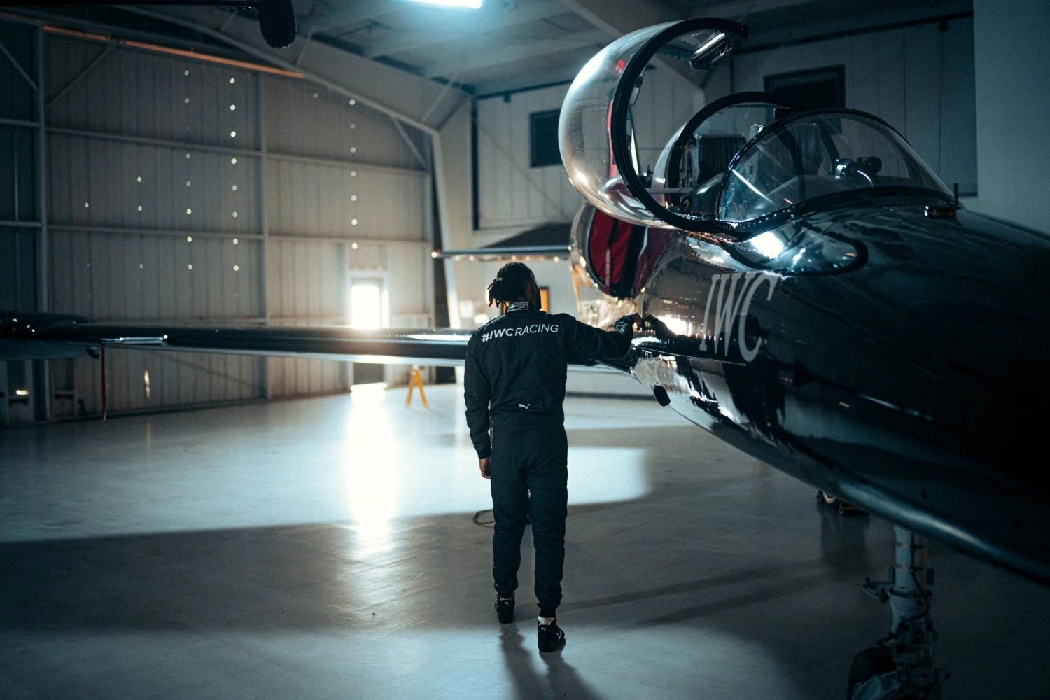 Lewis Hamilton's Mercedes in a standing start race against a fighter ...